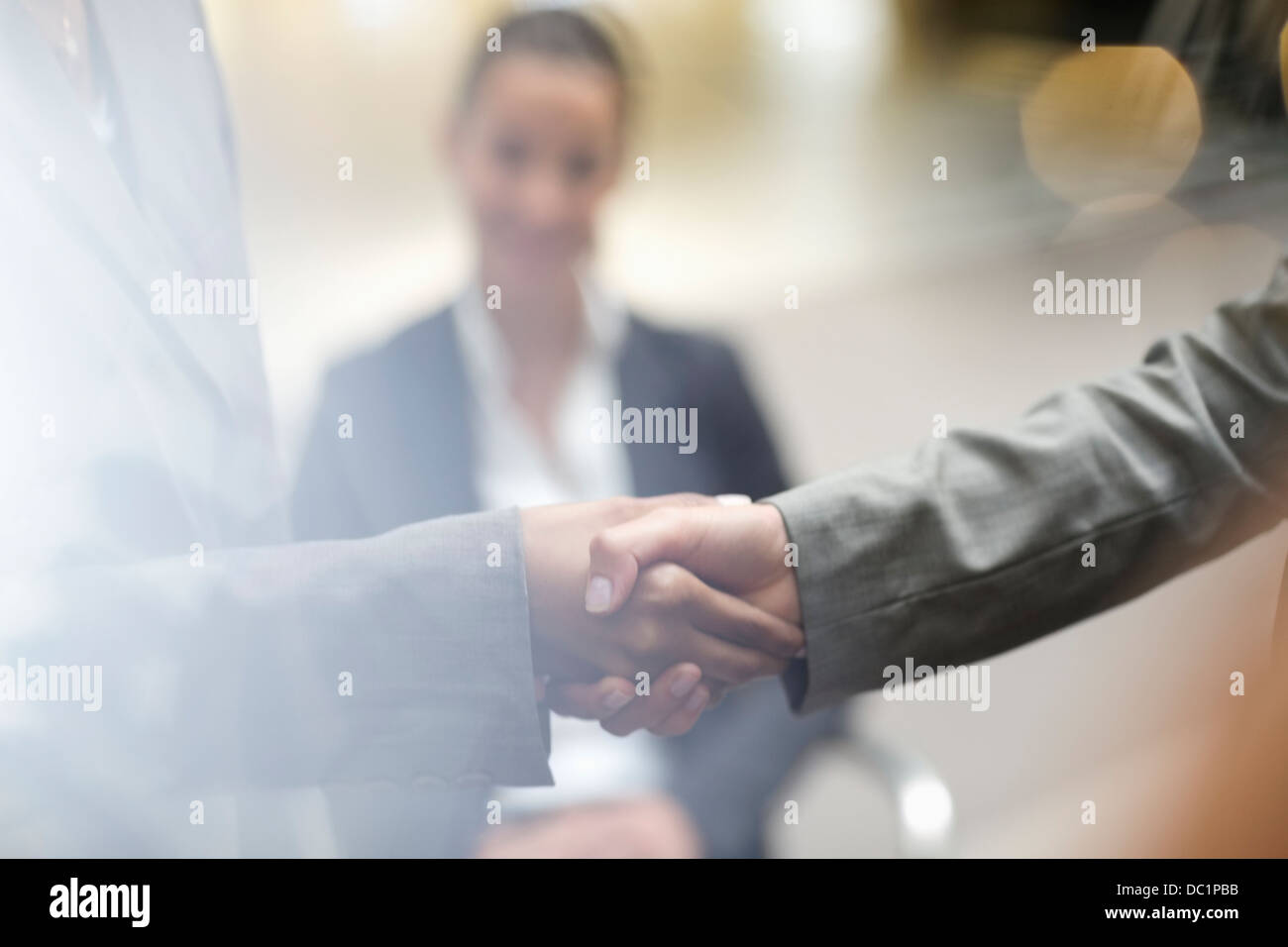 Business people handshaking office hi-res stock photography and images ...