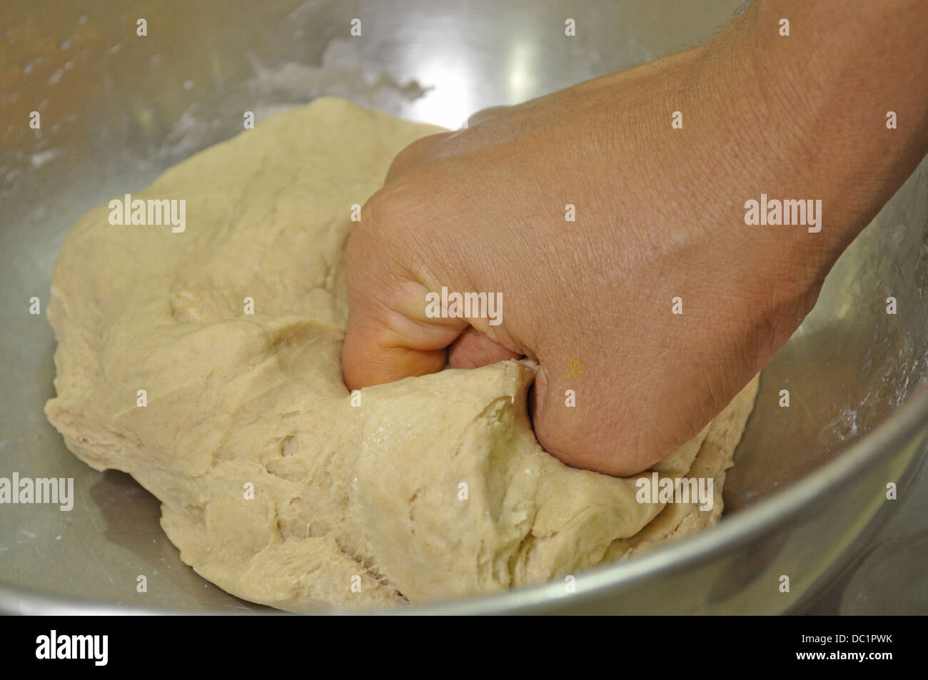 Indian woman kneading dough hi-res stock photography and images - Alamy
