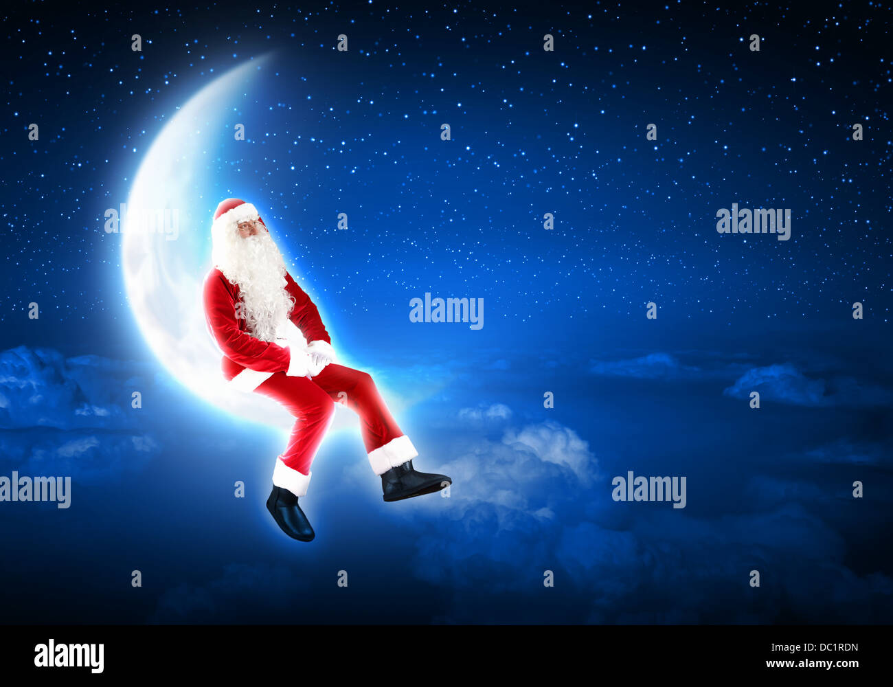 photo of santa claus sitting on the moon Stock Photo - Alamy