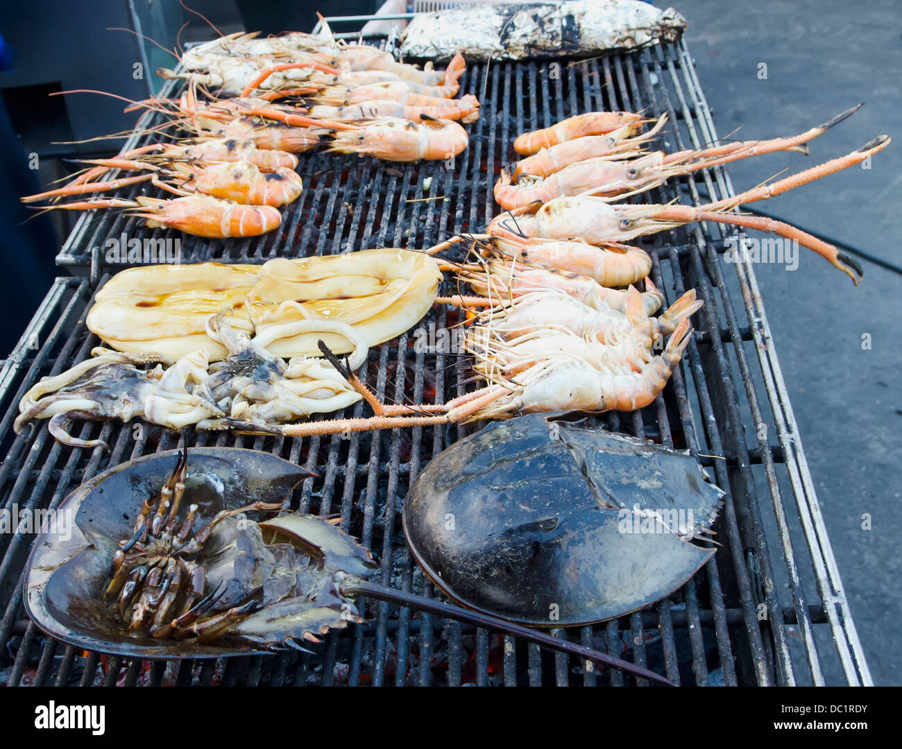 Seafood grill on the stove Stock Photo - Alamy