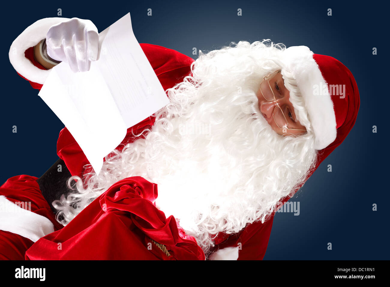 santa claus reading a letter Stock Photo - Alamy