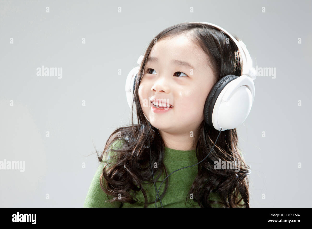 a girl wearing a headphone Stock Photo - Alamy
