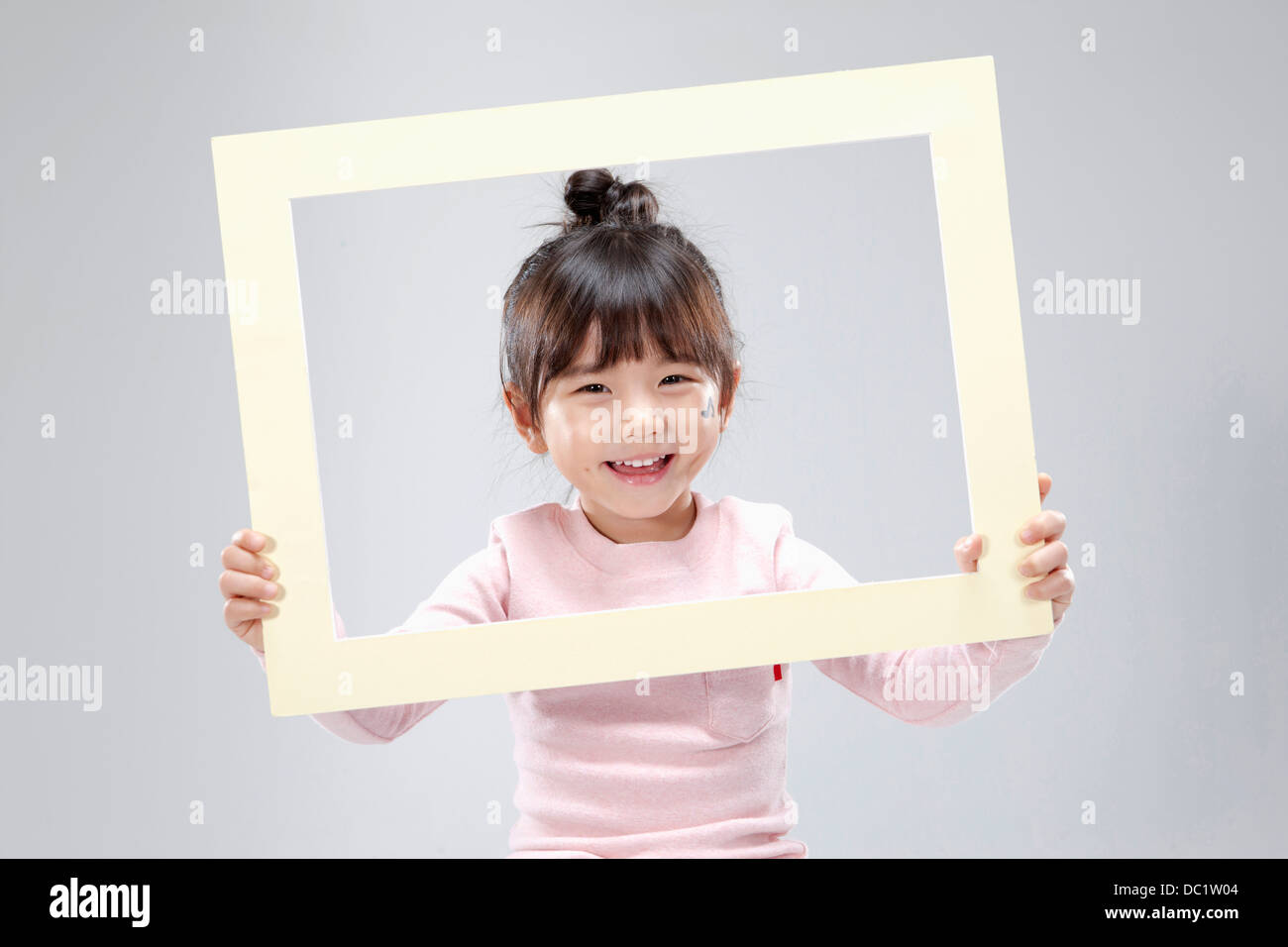 a girl inside an empty frame Stock Photo - Alamy