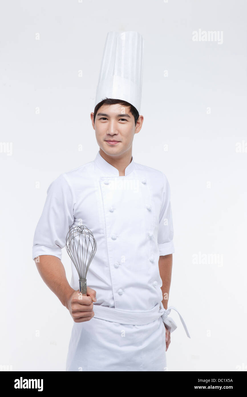 a male cook posing with cooking tool Stock Photo - Alamy