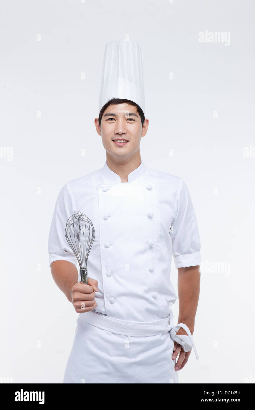 a male cook posing with cooking tool Stock Photo - Alamy