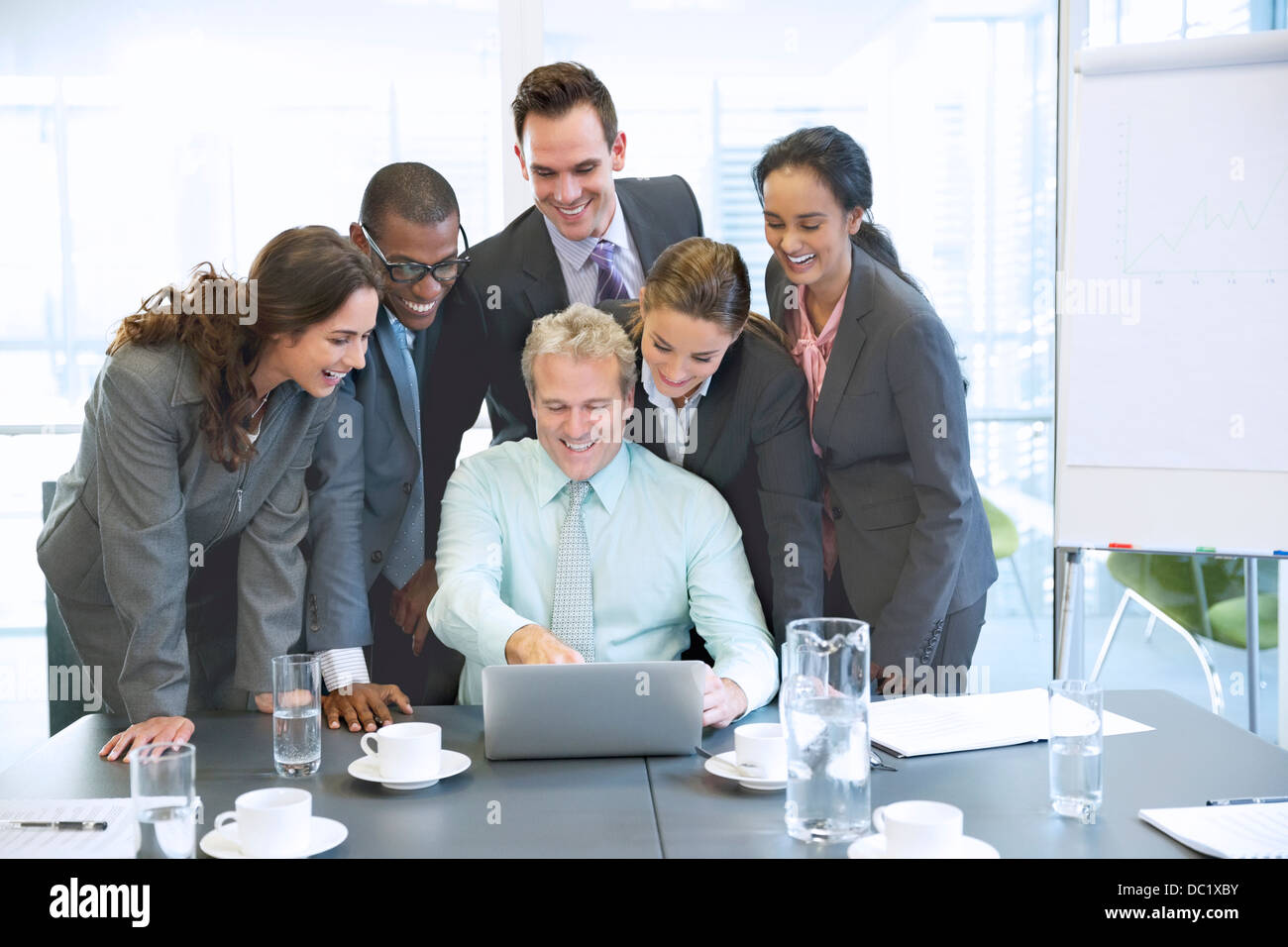 Business man pointing laughing hi-res stock photography and images - Alamy