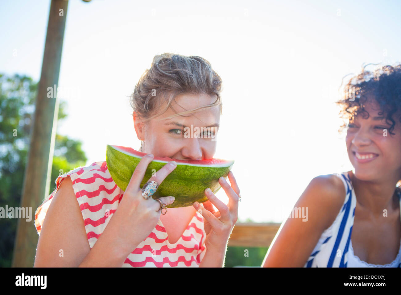 Young woman eating watermelon, portrait Stock Photo - Alamy