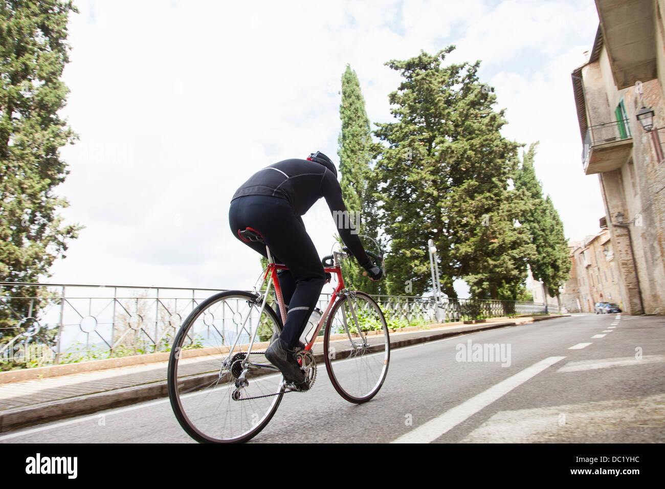 Man riding bicycle uphill on hi-res stock photography and images - Alamy