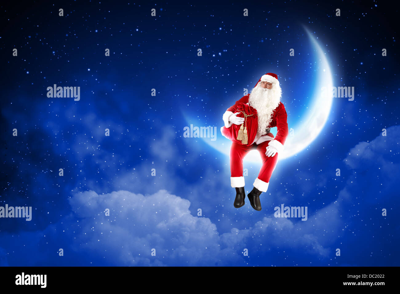 photo of santa claus sitting on the moon Stock Photo - Alamy