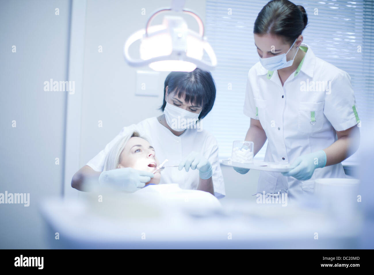Nurse treating patient hi-res stock photography and images - Alamy