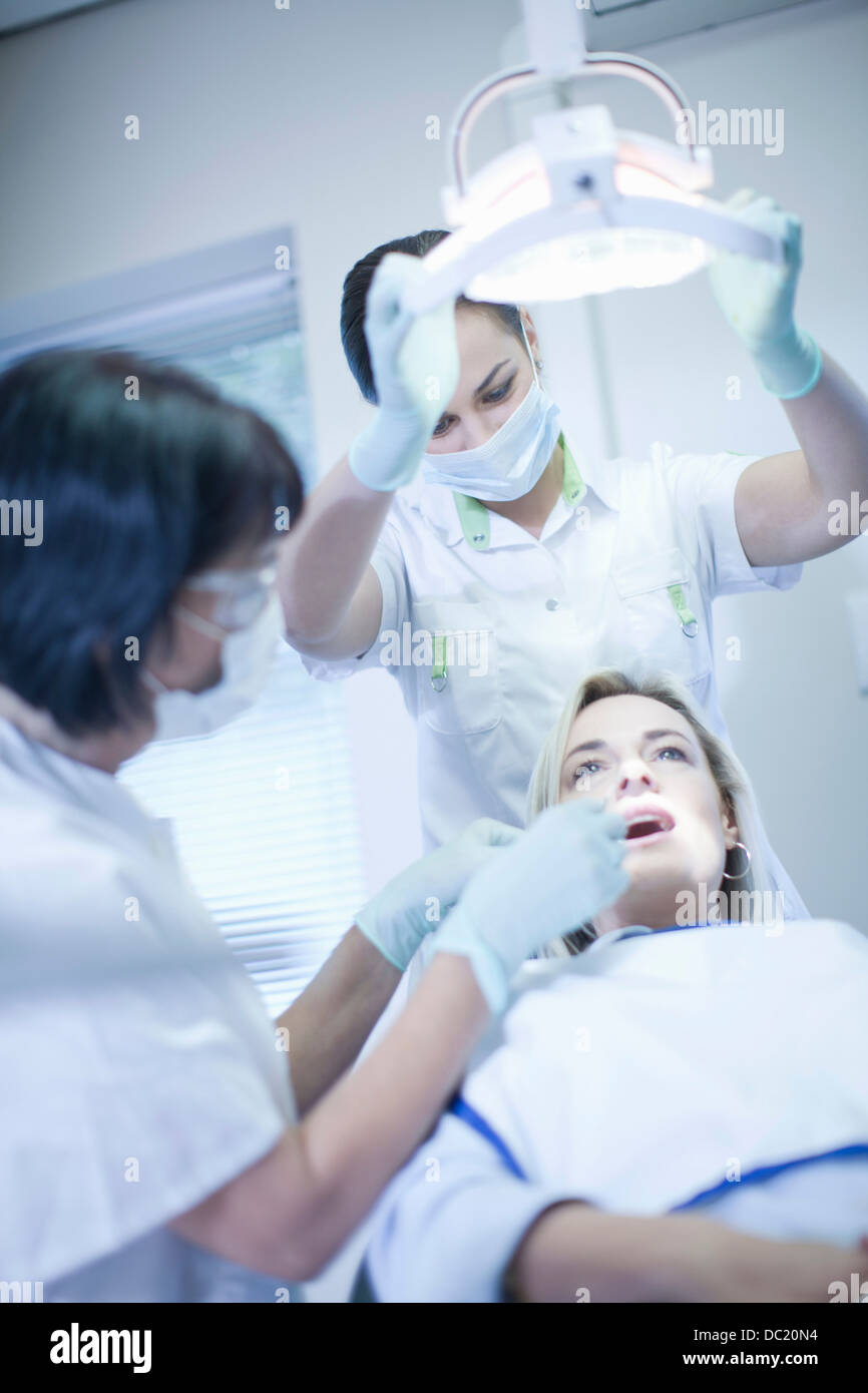 Dentist checking patients teeth Stock Photo - Alamy