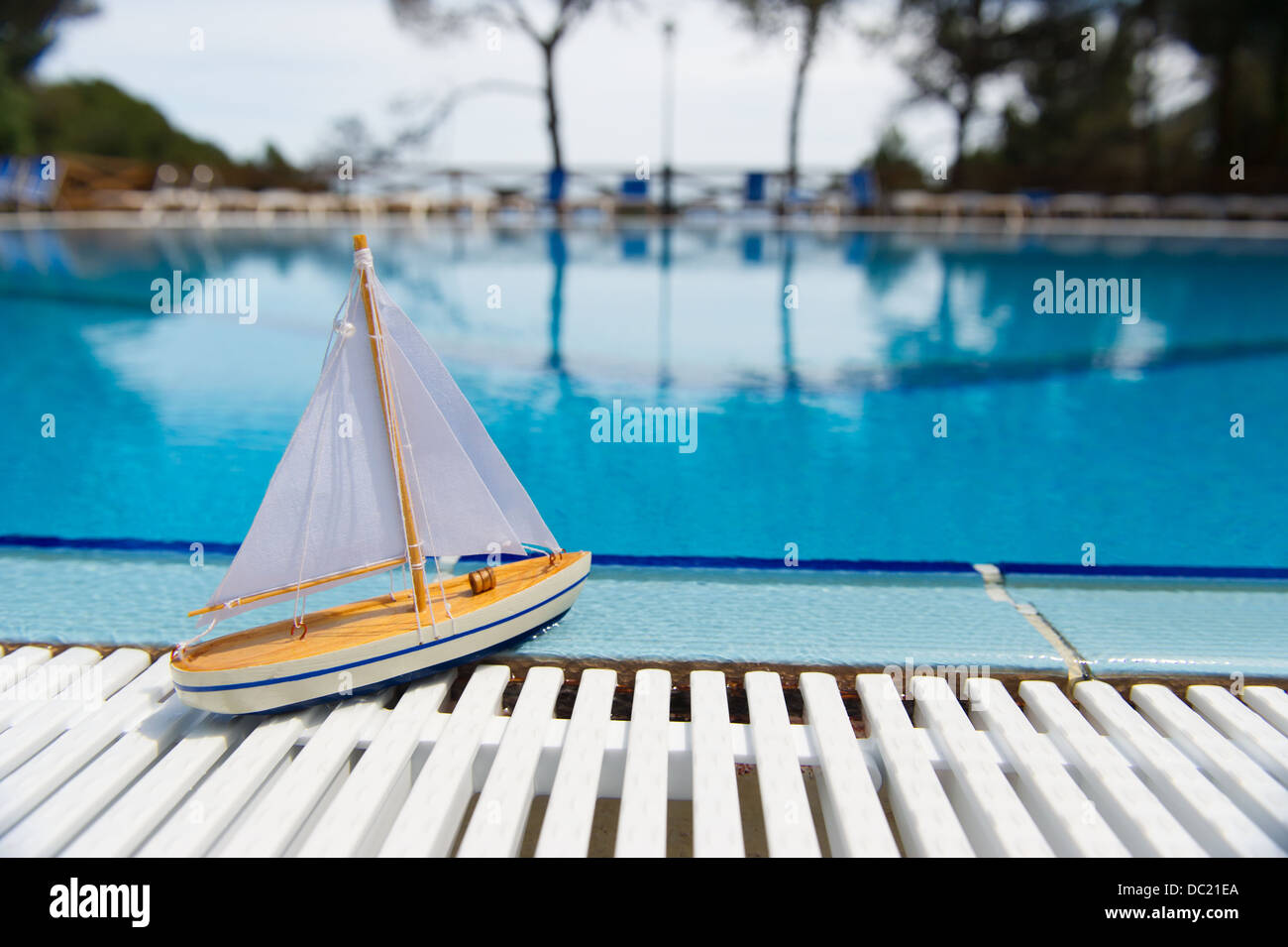 Little sailboat to play with at swimming pool Stock Photo - Alamy