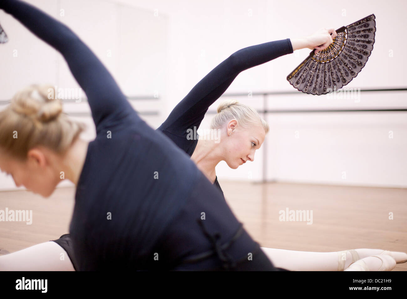 Woman sitting on symmetrical hi-res stock photography and images - Alamy