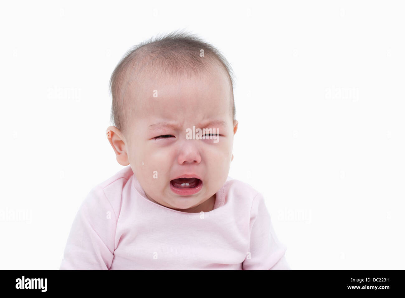 a baby crying in white background Stock Photo - Alamy