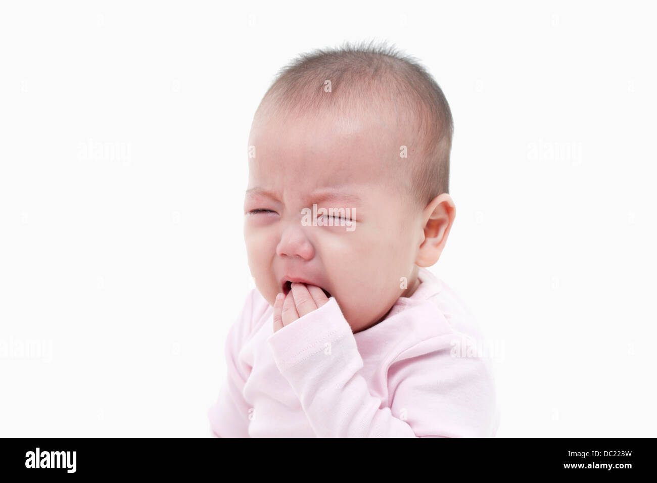 a baby crying in white background Stock Photo - Alamy