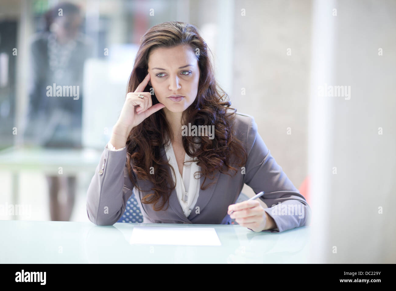 Young stressed businesswoman in office Stock Photo - Alamy