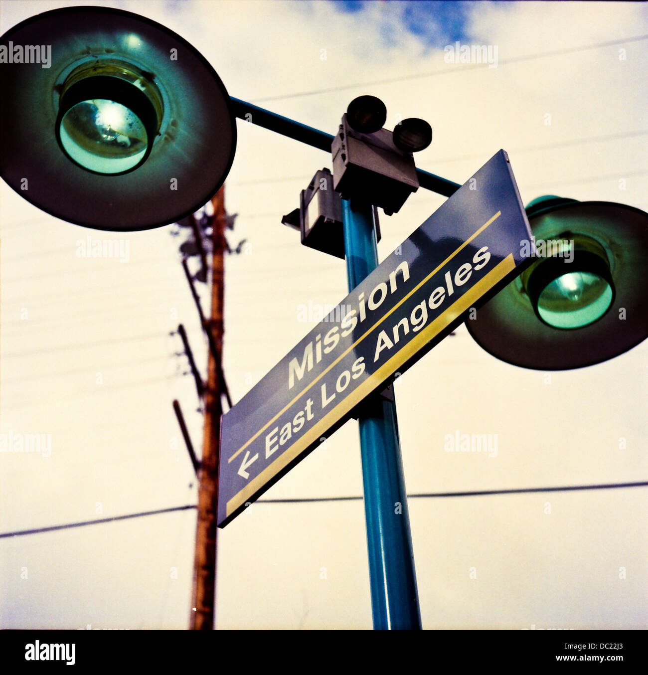 Low angle view of sign post pointing to east Los Angeles, California ...