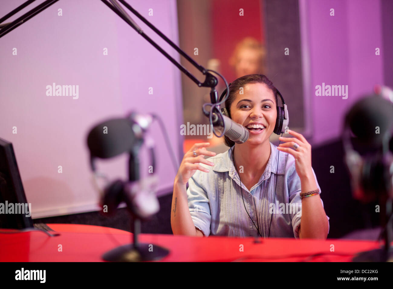Young woman broadcasting in recording studio, portrait Stock Photo - Alamy