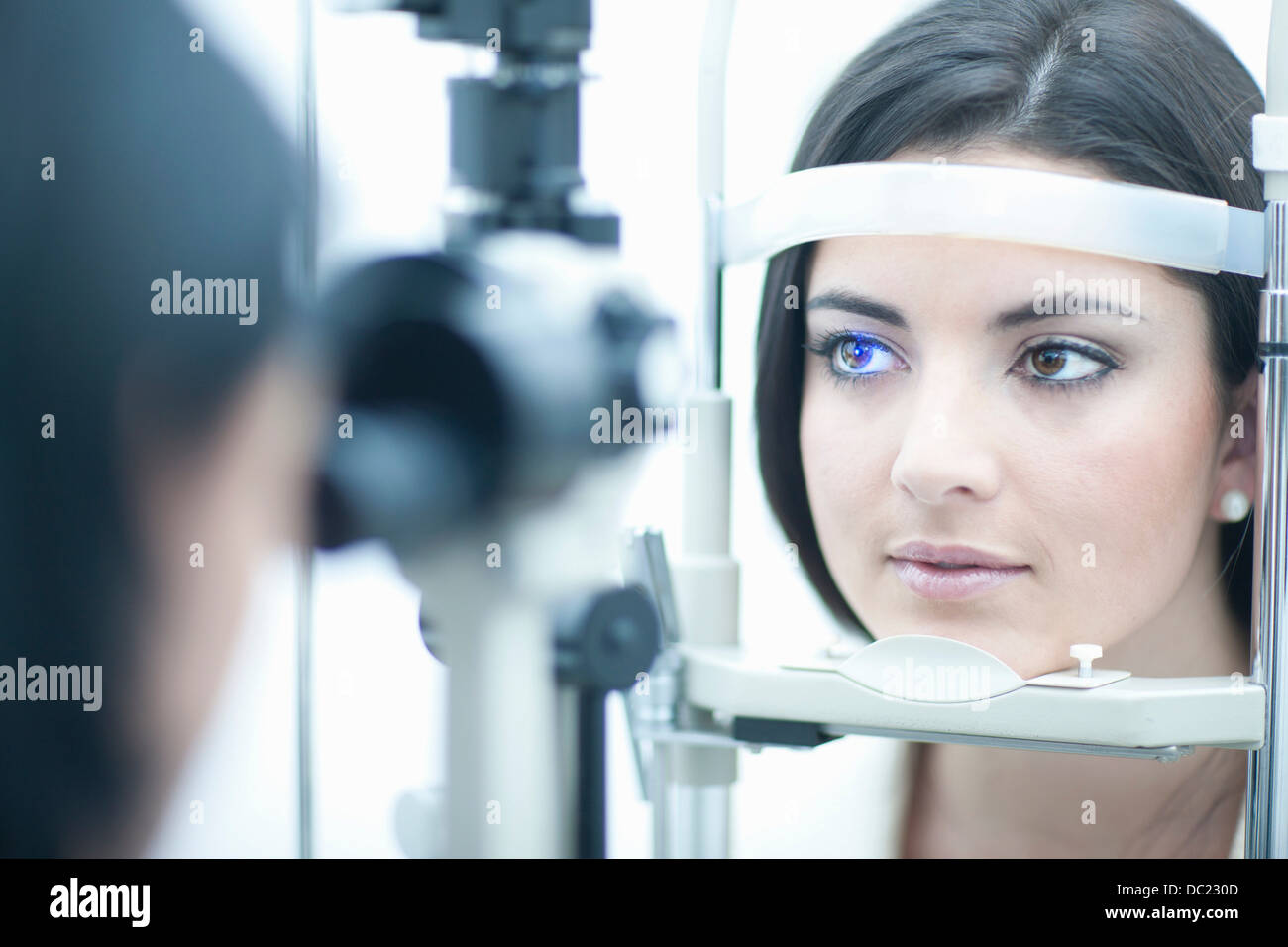 Young woman having eye examination Stock Photo - Alamy
