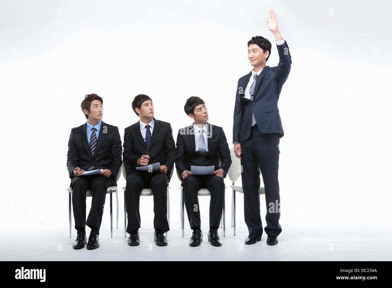 Man suit full length raising hand hi-res stock photography and images ...