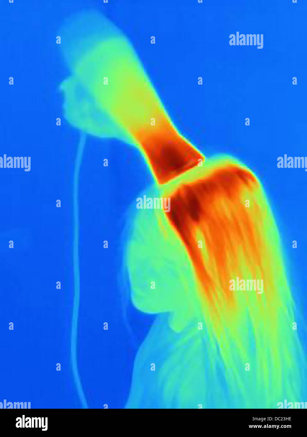 Thermal image of young woman drying her hair Stock Photo - Alamy