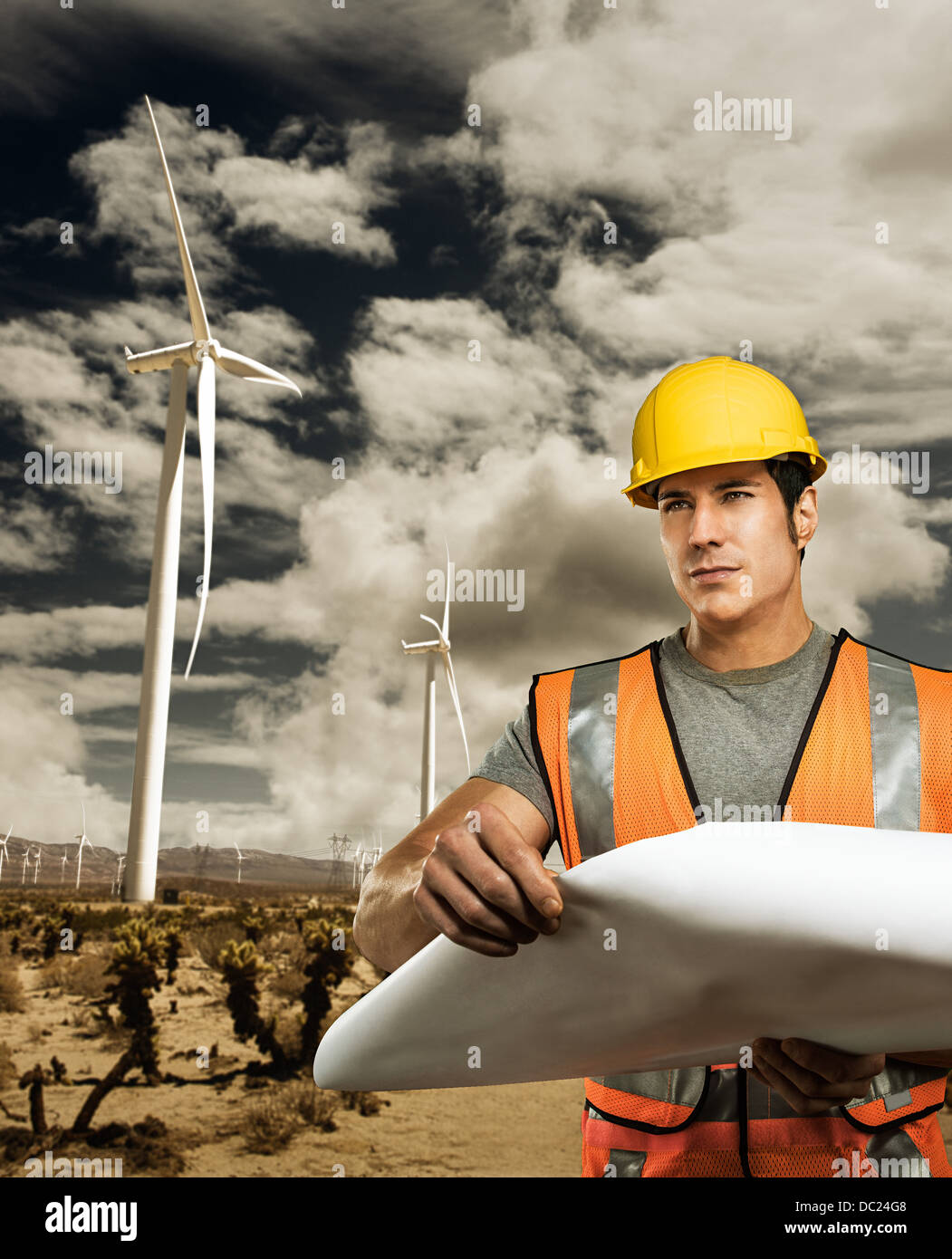 Man standing in front of wind farm Stock Photo - Alamy