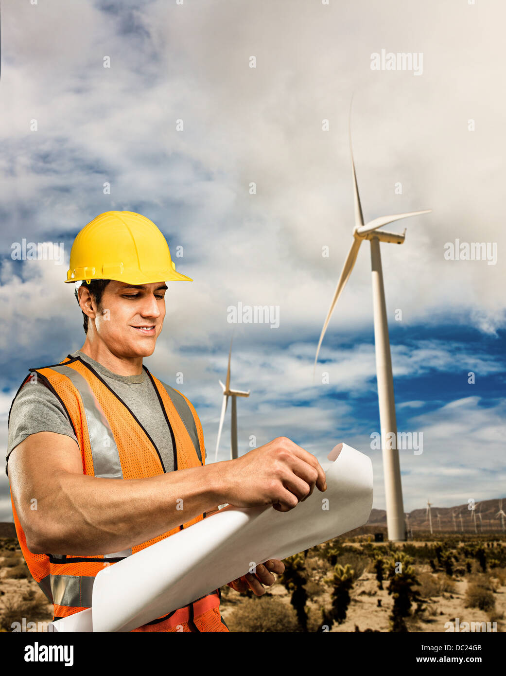 Man standing in front of wind farm Stock Photo - Alamy
