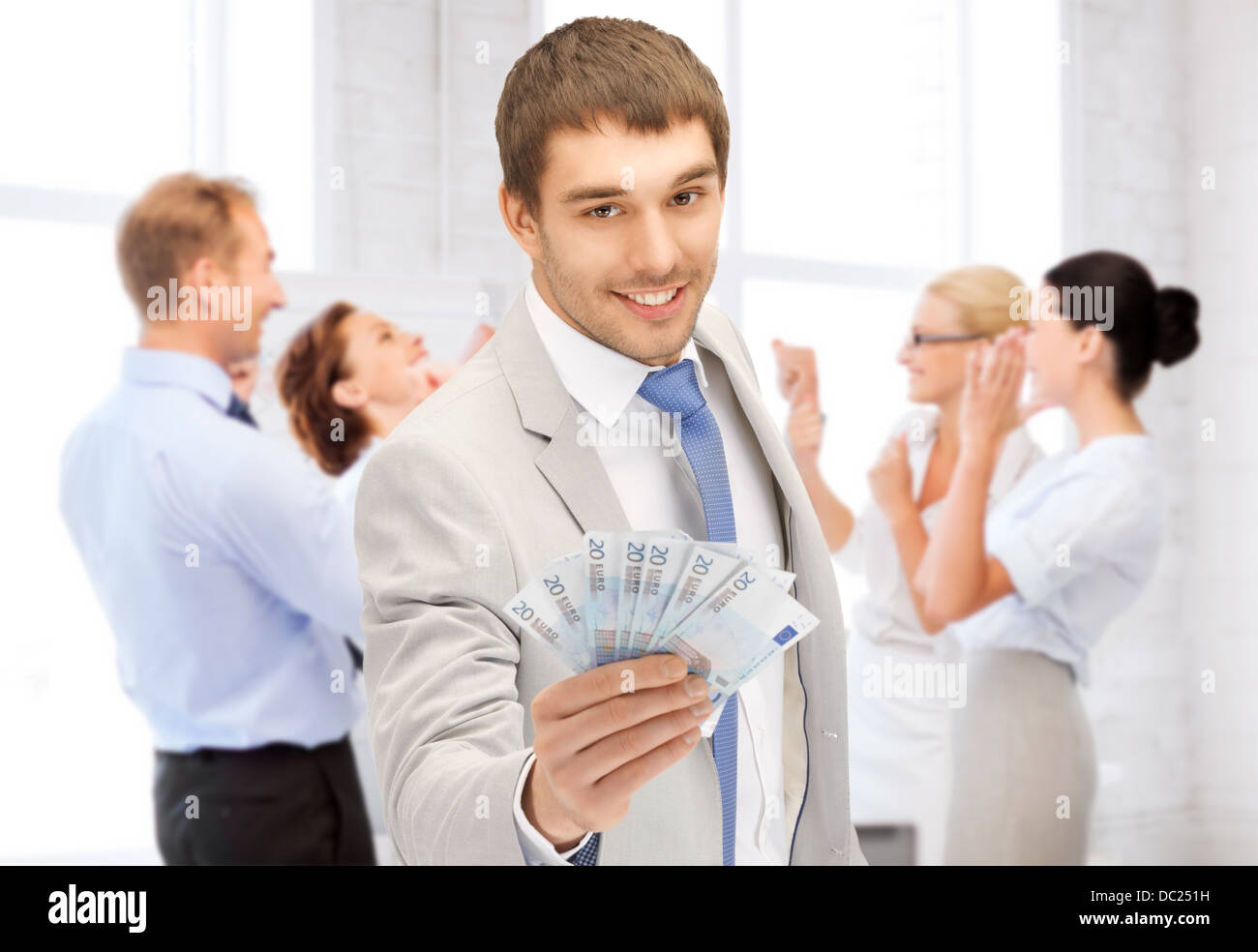 happy businessman with cash money in office Stock Photo - Alamy