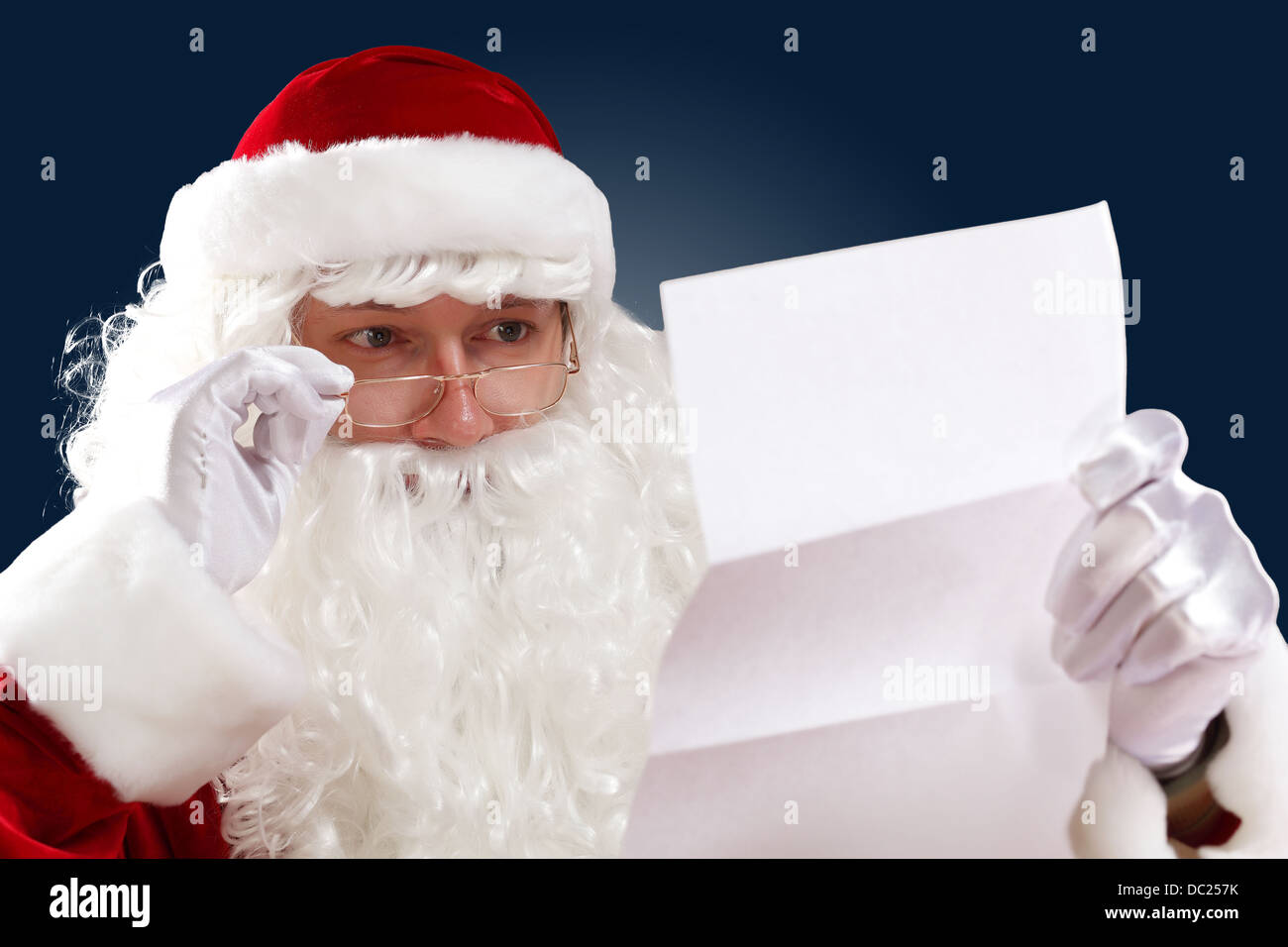 santa claus reading a letter Stock Photo - Alamy