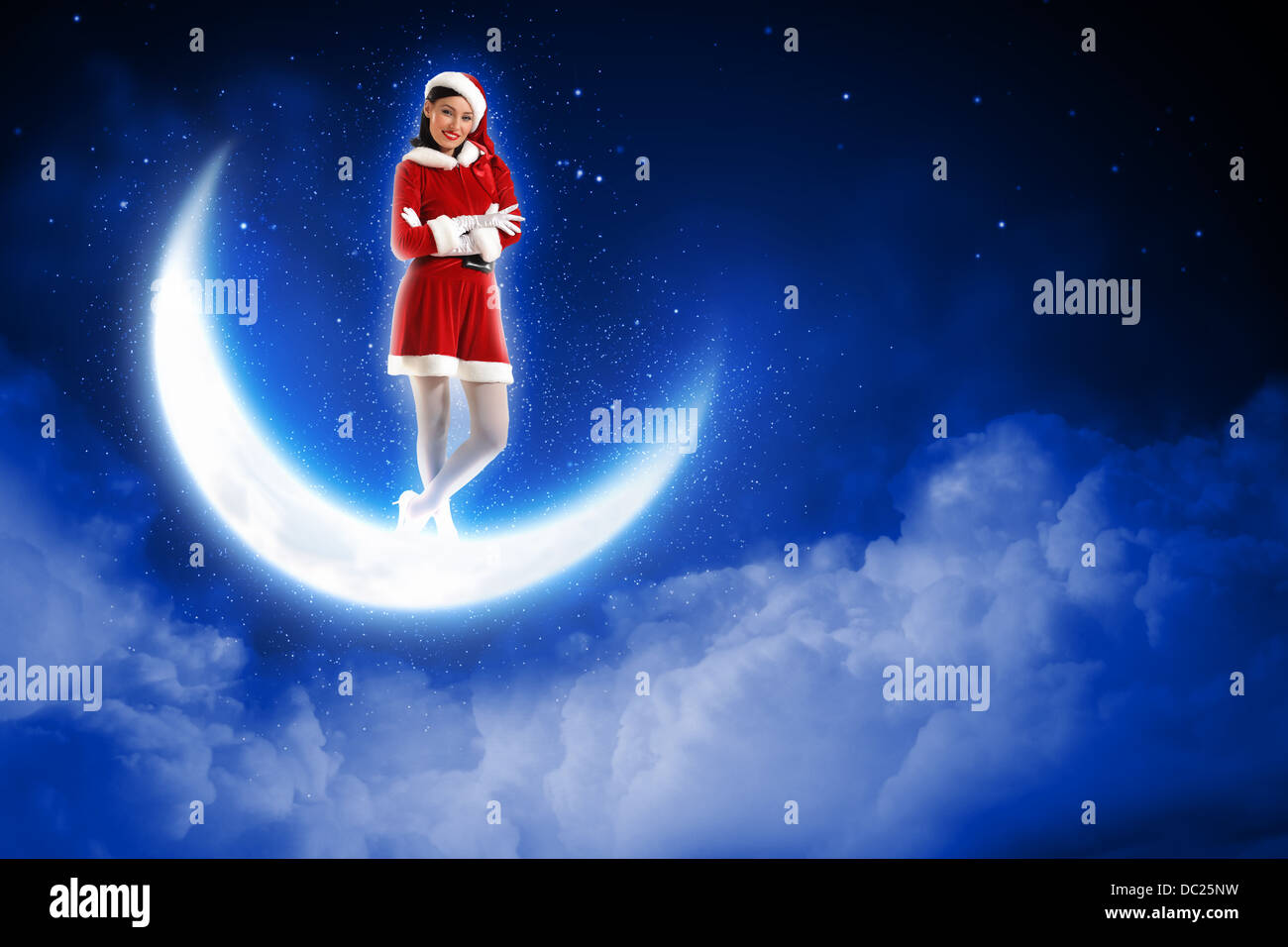 photo of santa girl sitting on the moon Stock Photo - Alamy