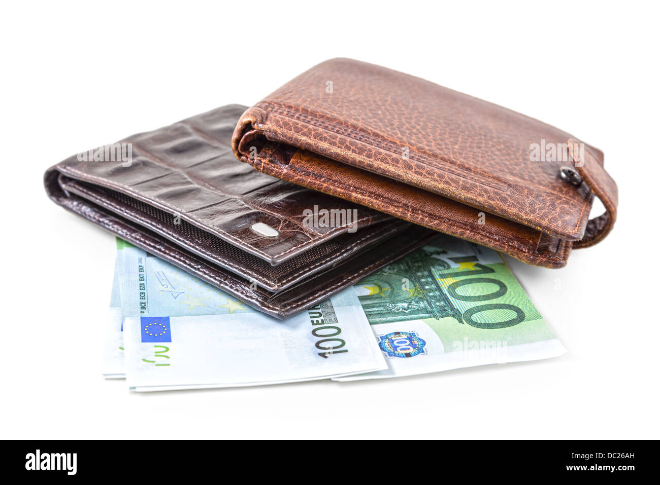 The two brown leather wallet with euro and dollars is photographed on ...