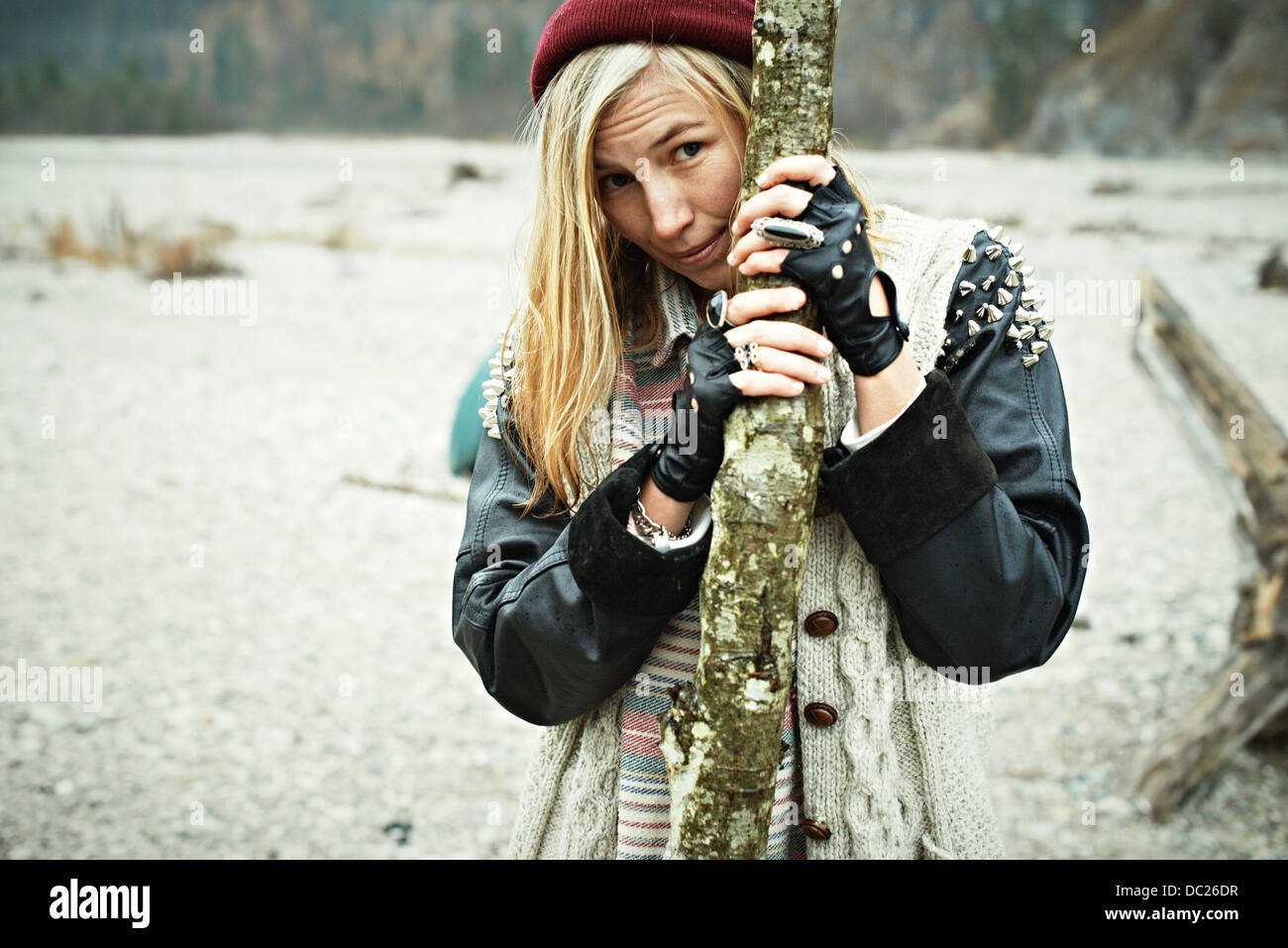 Woman holding log Stock Photo - Alamy