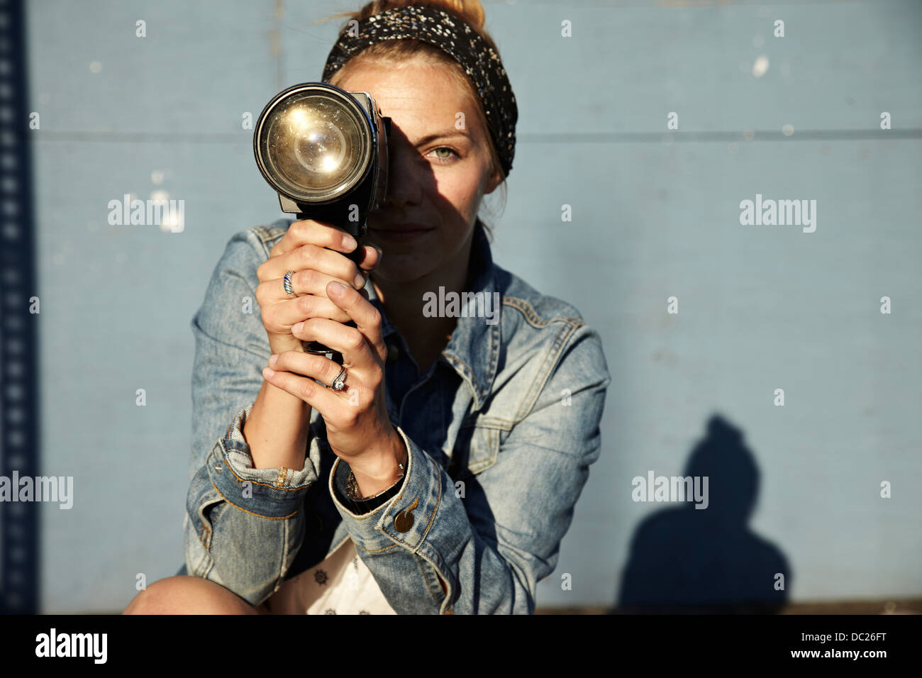 Woman using old video camera Stock Photo - Alamy