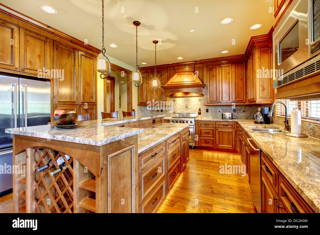 Luxury wood kitchen with granite countertop Stock Photo - Alamy