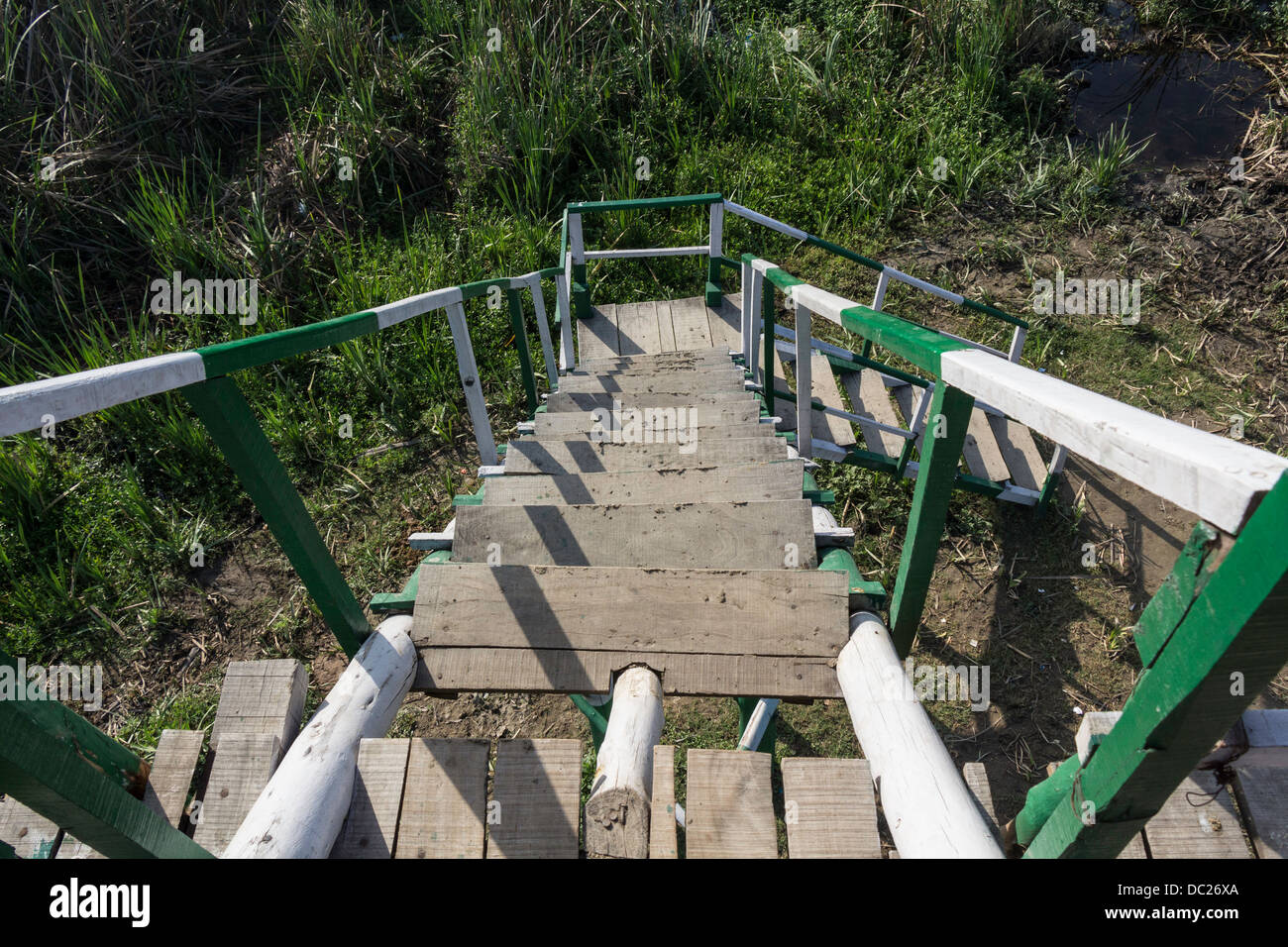 Wooden steps coming down from a watchtower. This is a makeshift tower ...