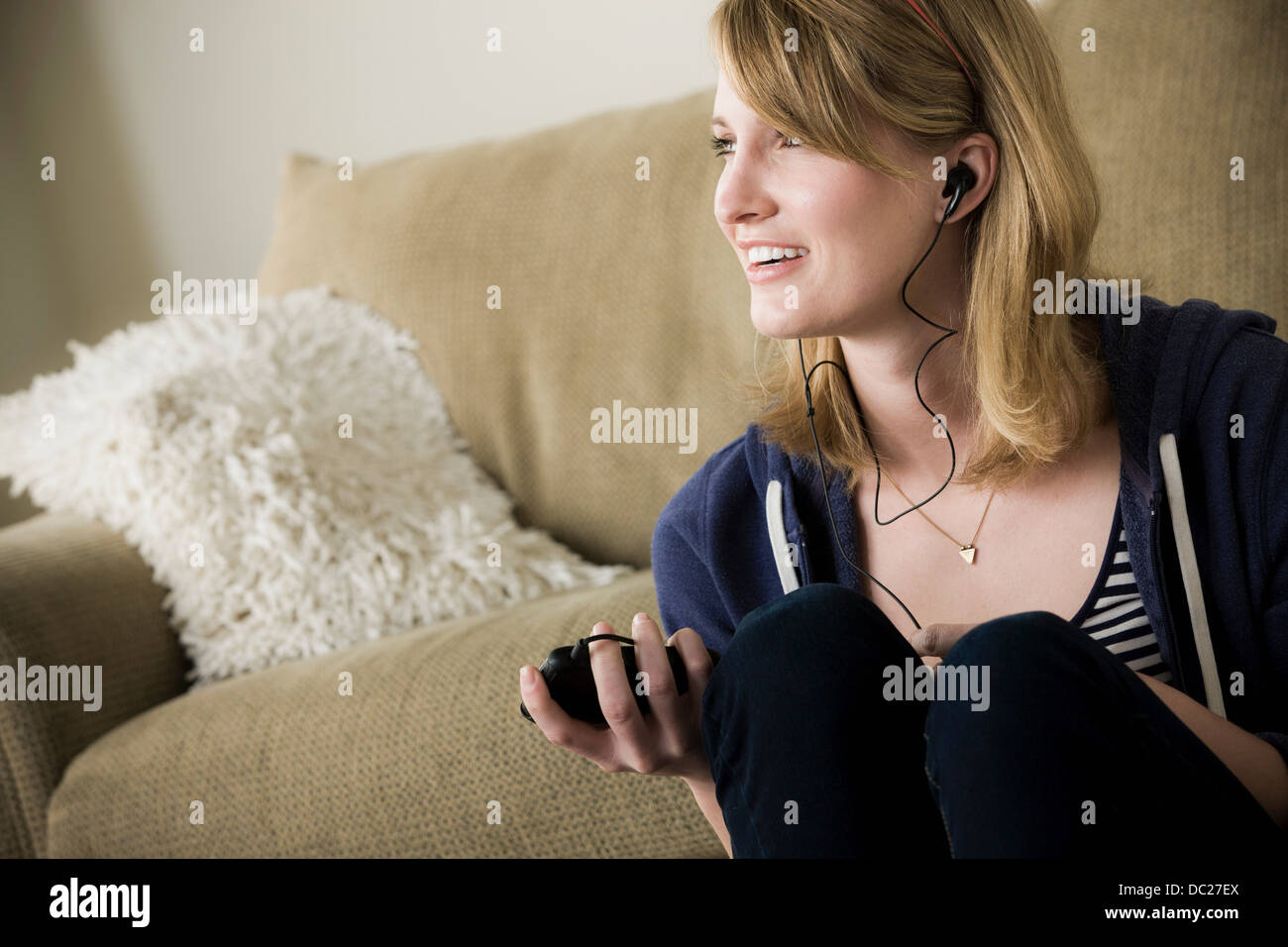 Woman wearing earphones hi-res stock photography and images - Alamy