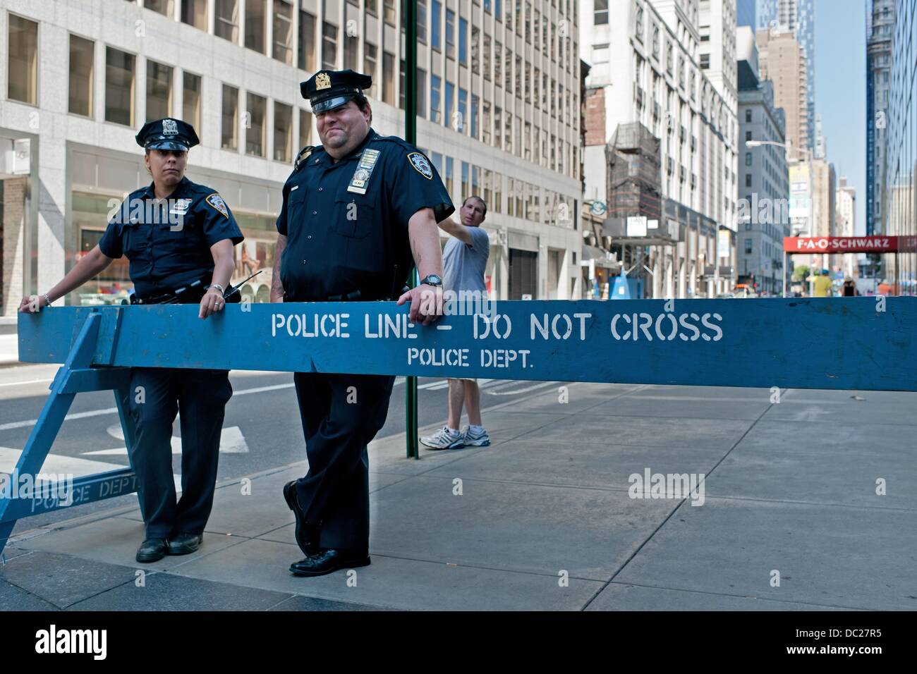 Two police officers stand behind a barrier in New York, USA, 02 June ...