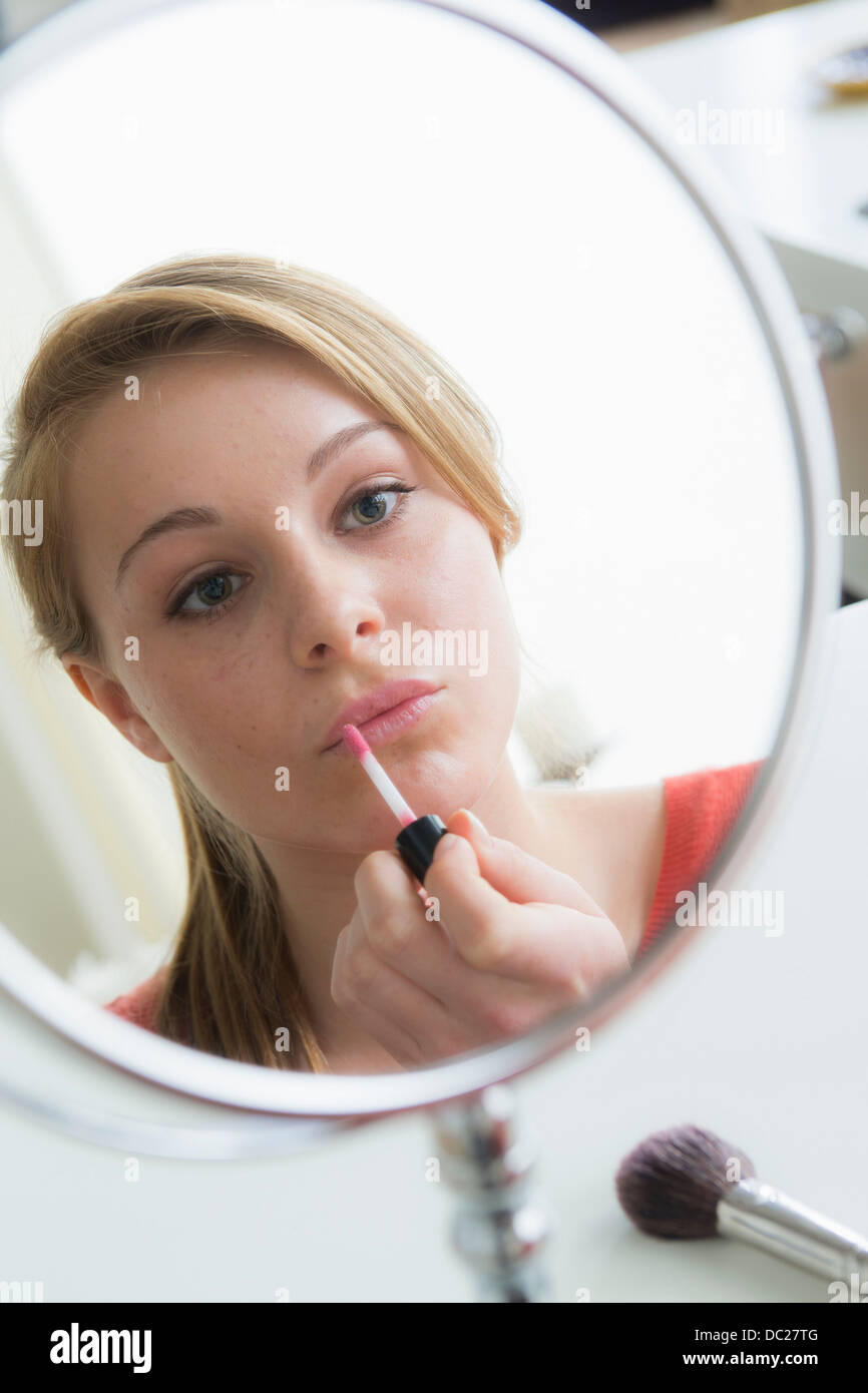 Teenager girl applying lipstick hi-res stock photography and images - Alamy