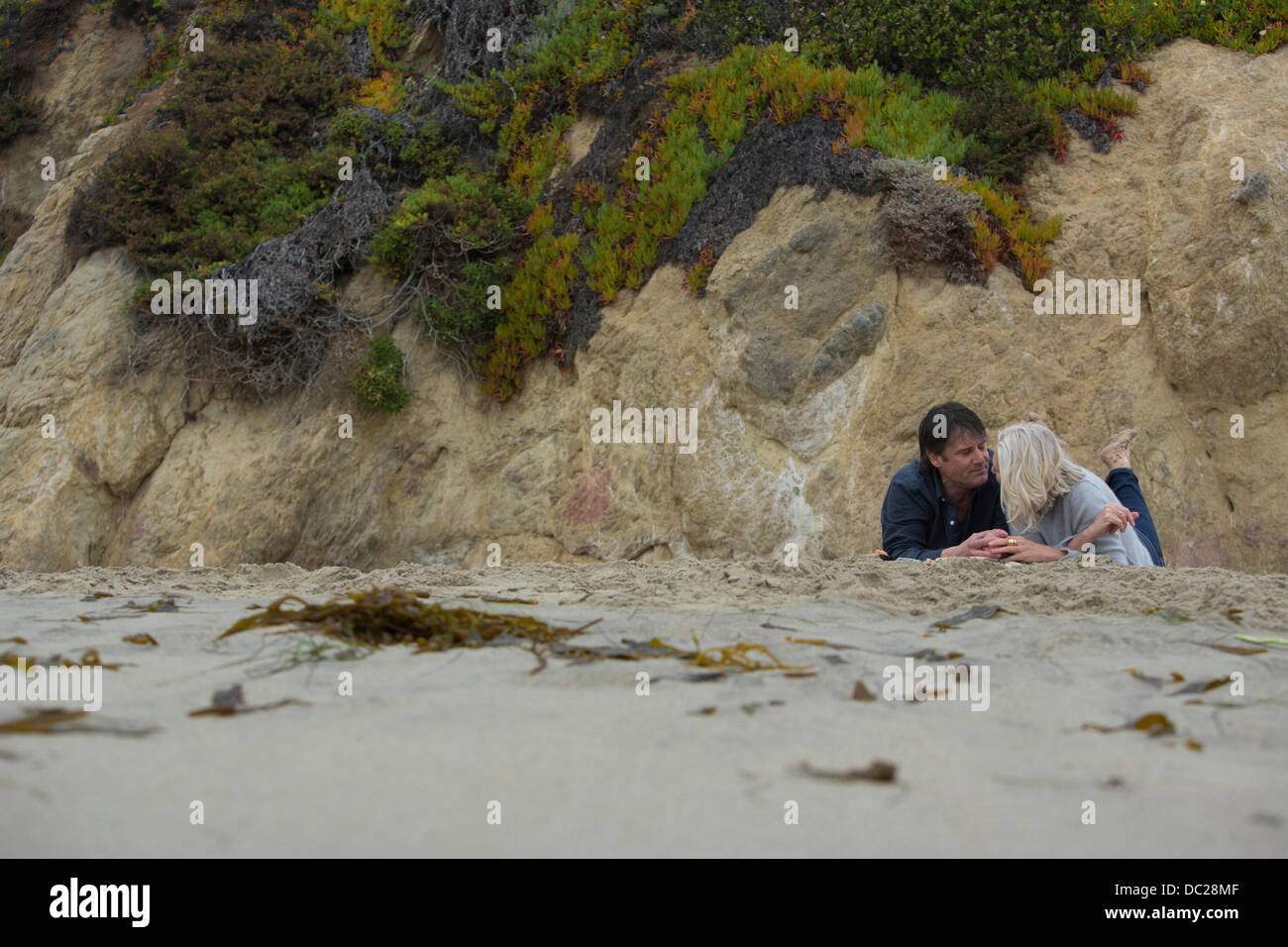 Lying down on rocks hi-res stock photography and images - Alamy