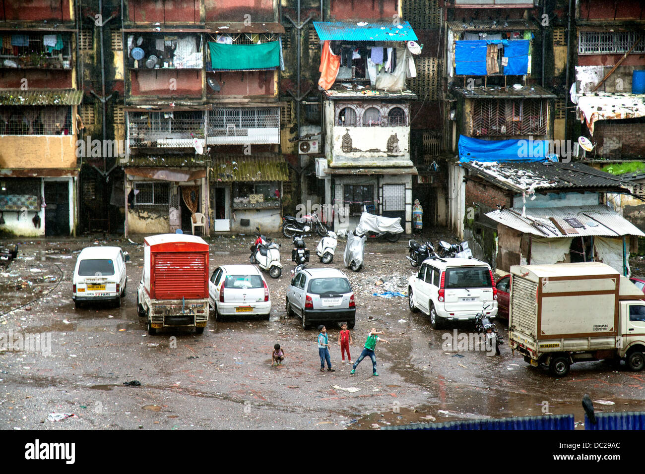 Bandra area slum boys throwing stones car park Stock Photo - Alamy