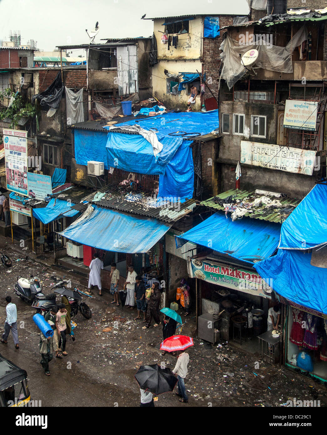 Slum buildings life children playing hanging out of window held by legs ...