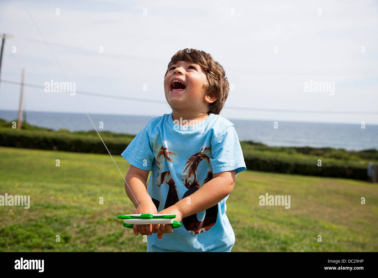 Boy flying kite Stock Photo - Alamy