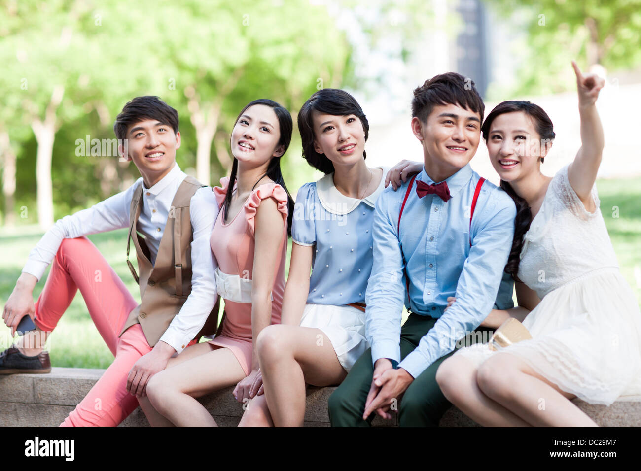 Stylish young Chinese people sitting together Stock Photo - Alamy