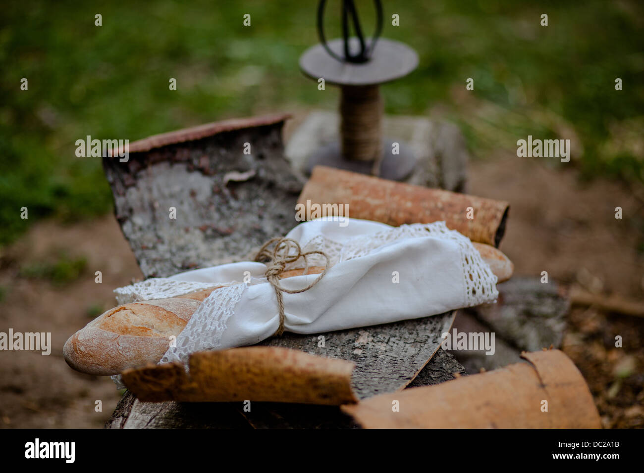 Bread wrapped in linen and tied with string Stock Photo - Alamy