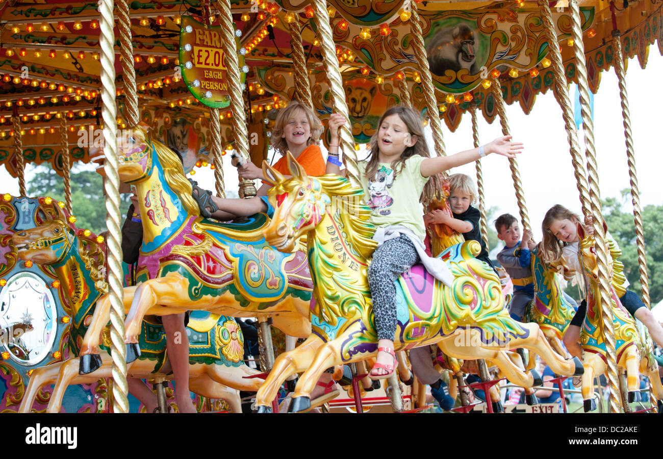 Happy, carefree white children laughing while sitting on decorative ...