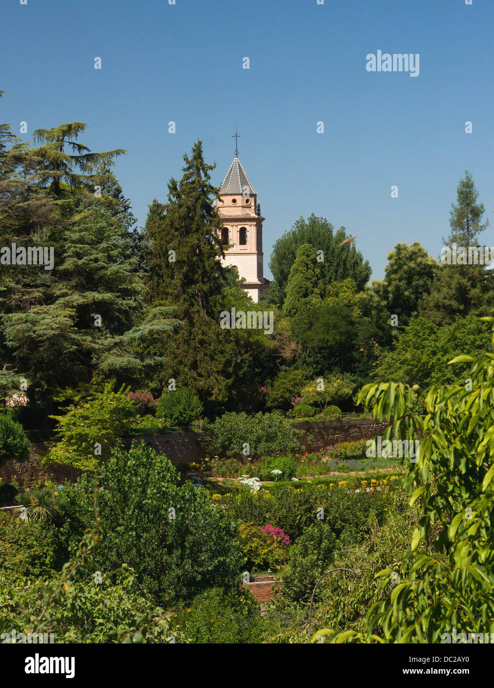 The bell tower of the church Santa Maria de la Alhambra, merging from ...