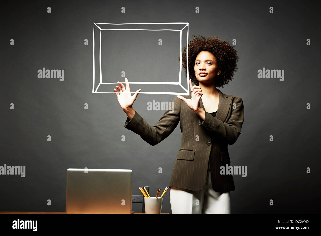 Woman looking at picture frame hi-res stock photography and images - Alamy
