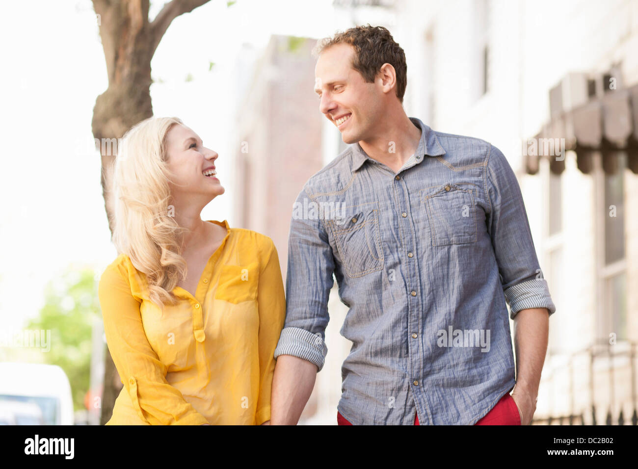 Couple smiling at each other Stock Photo - Alamy