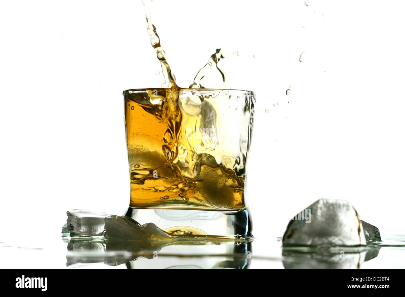 whisky splash alcohol drops isolated on white Stock Photo - Alamy