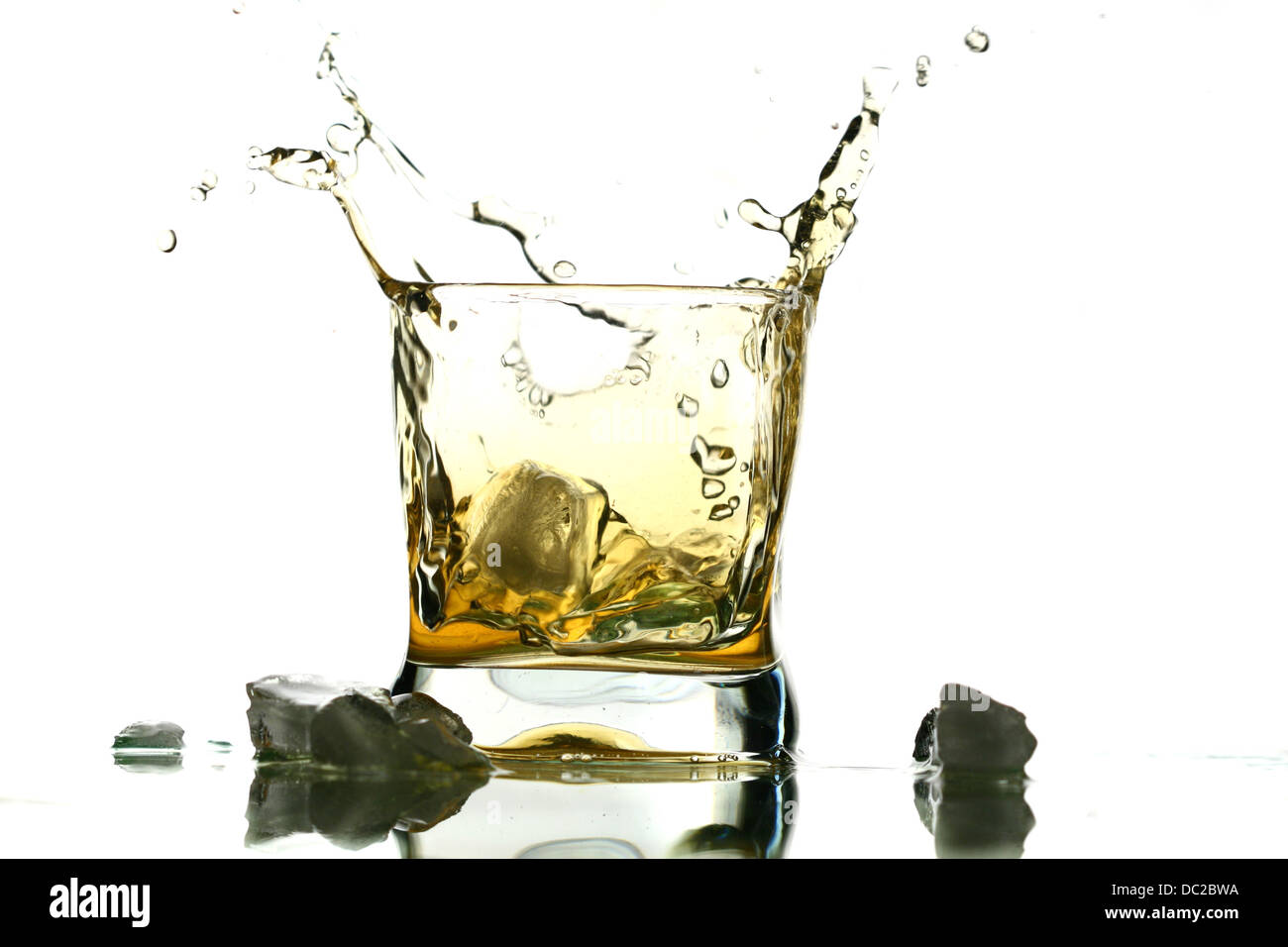 whisky splash alcohol drops isolated on white Stock Photo - Alamy